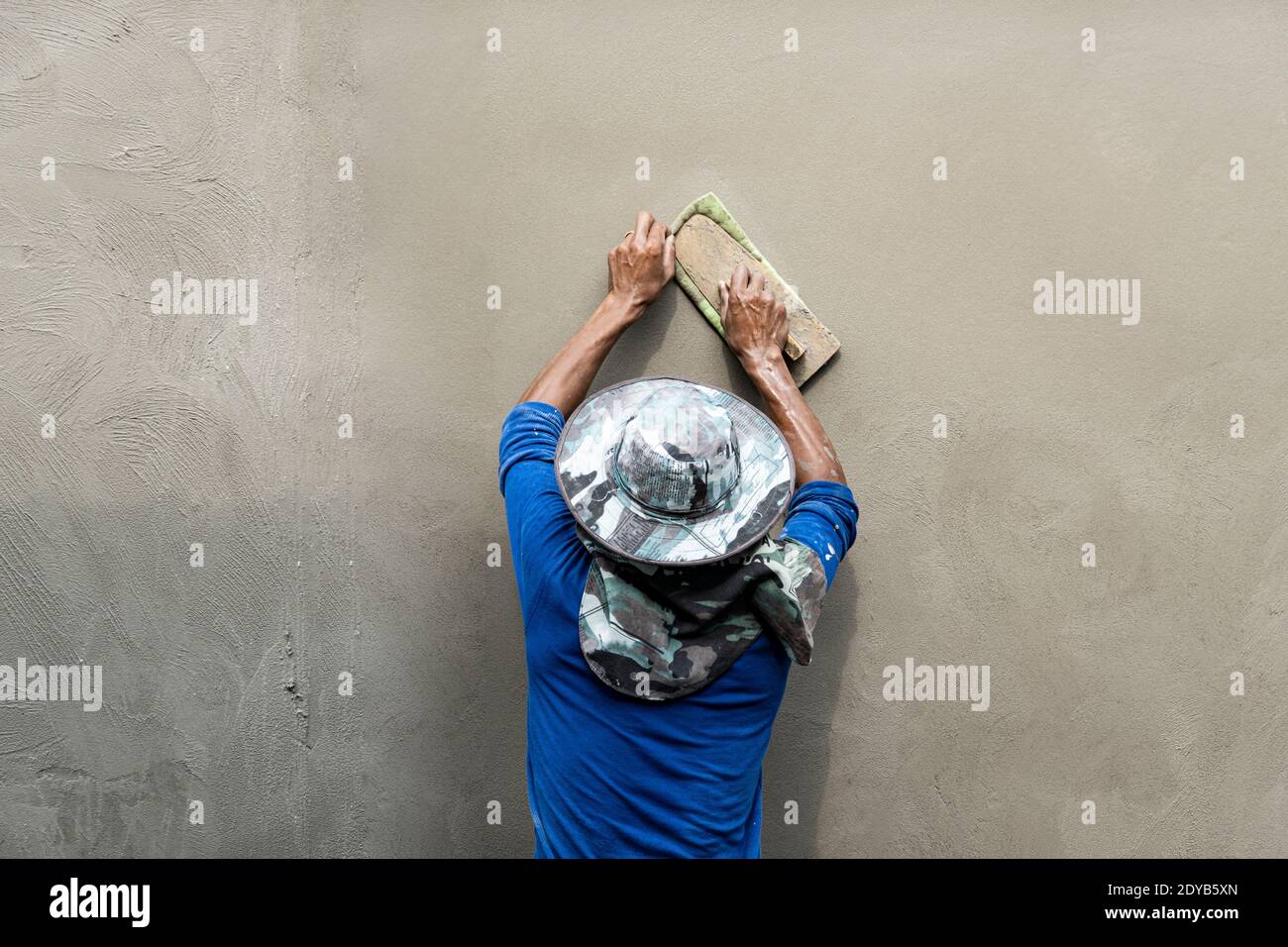 Rear View Of Mason Working At Construction Site Stock Photo - Alamy
