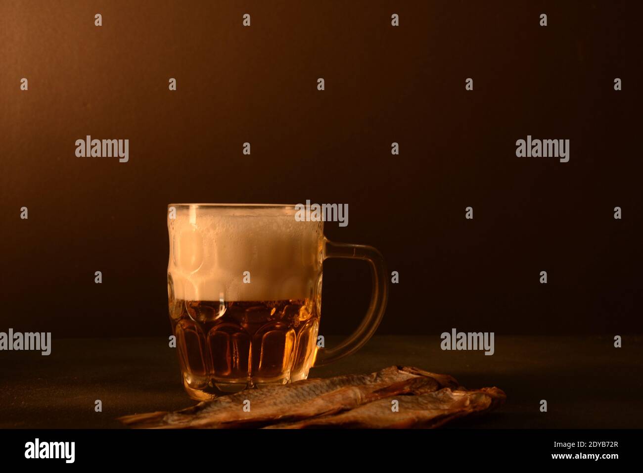 Beer mug and dried fish on dark background. Oktoberfest concept Stock ...