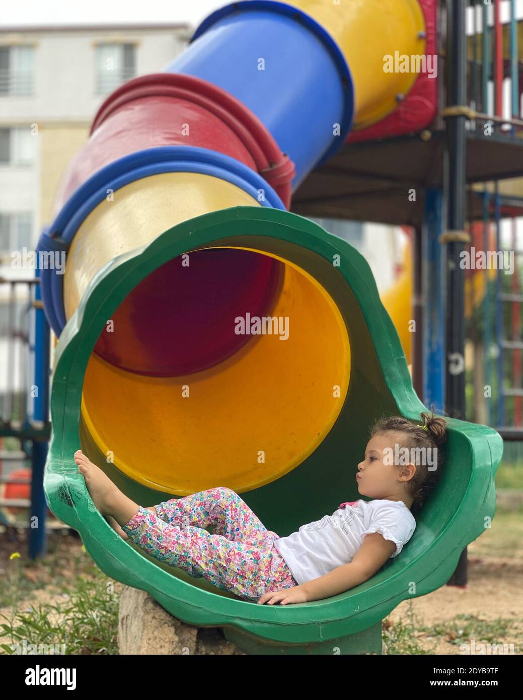 Sitting on slides hi-res stock photography and images - Alamy
