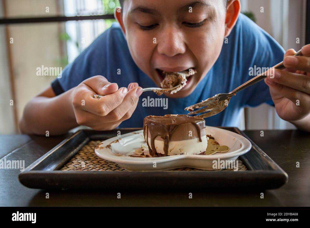 Indian child eating cake hi-res stock photography and images - Alamy