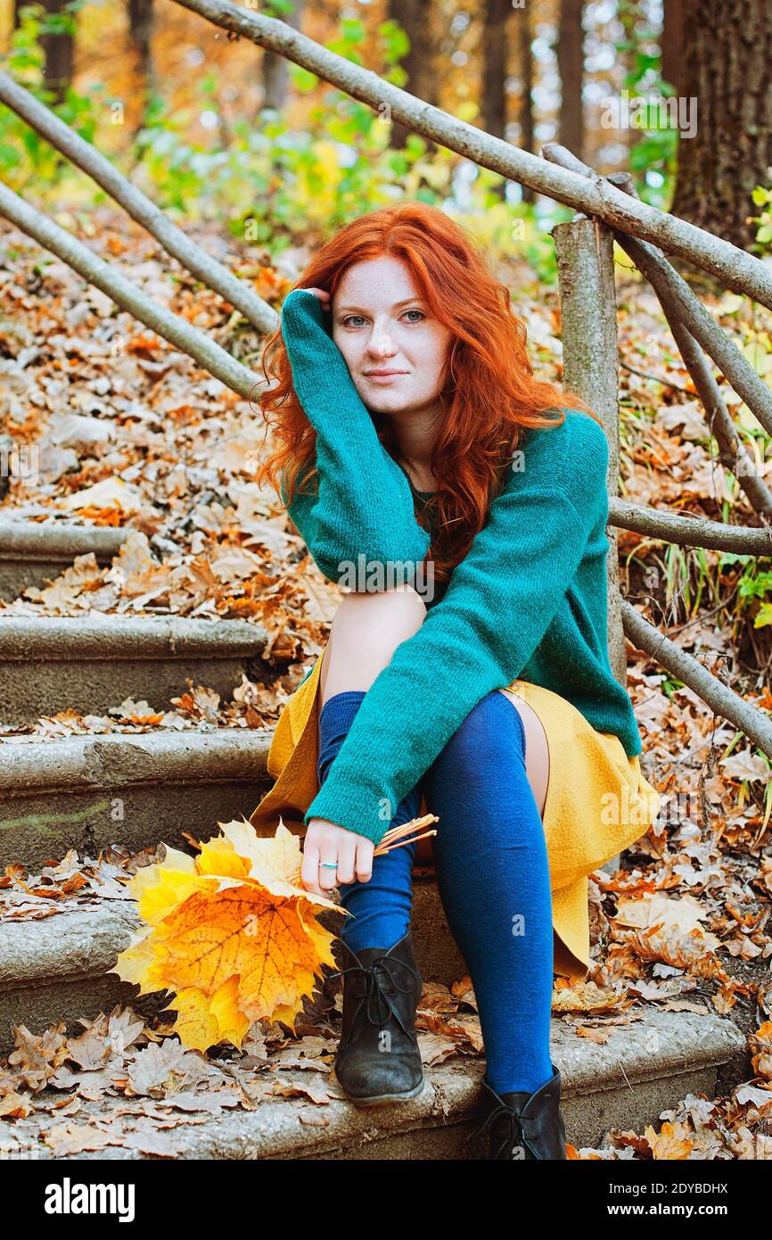 Redhead girl autumn leaves hi-res stock photography and images - Alamy