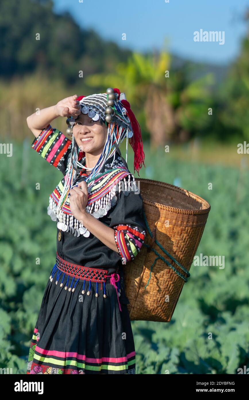 Portrait Of Woman In Traditional Clothing Standing Amidst Farm Stock ...