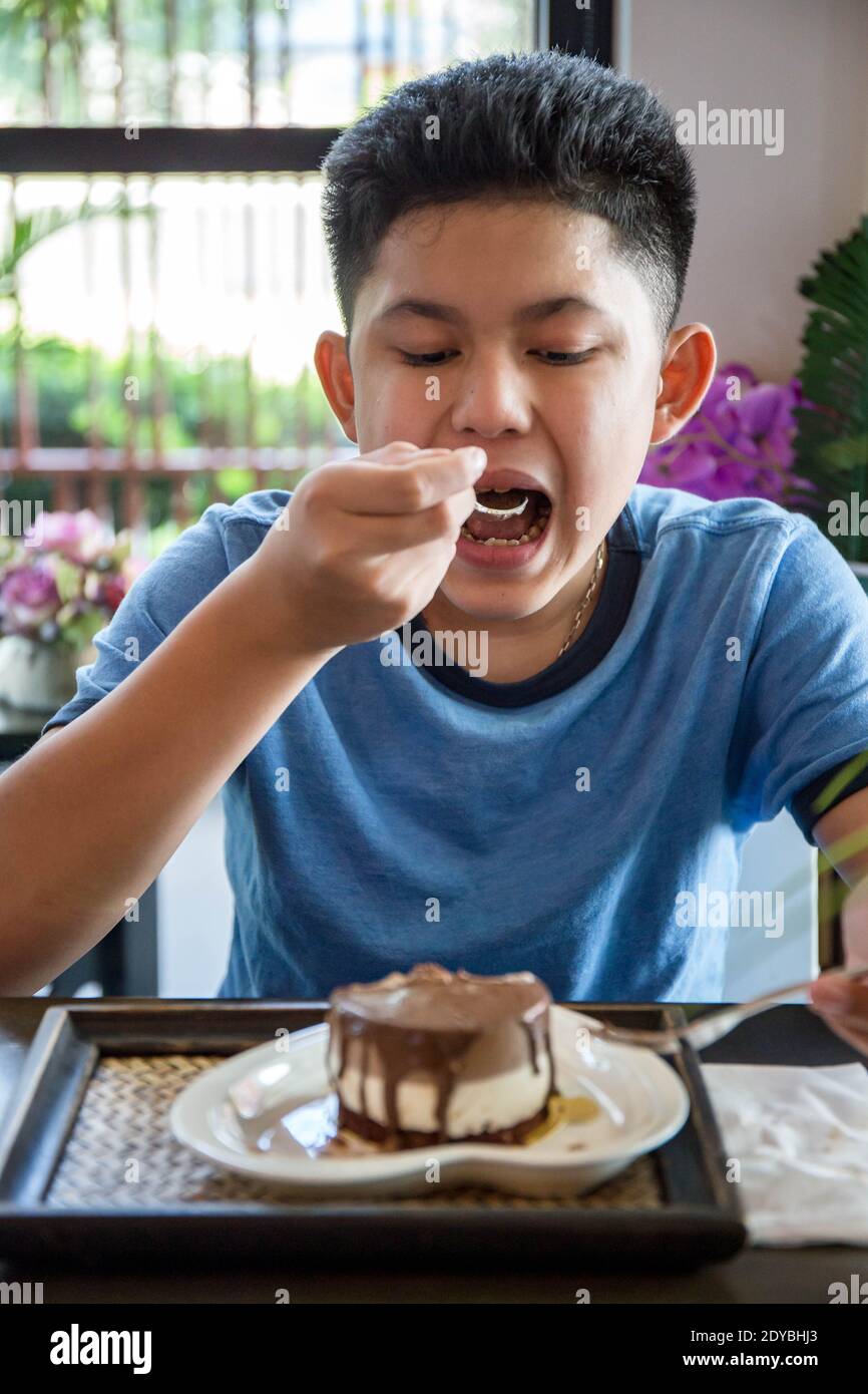 Indian child eating cake hi-res stock photography and images - Alamy