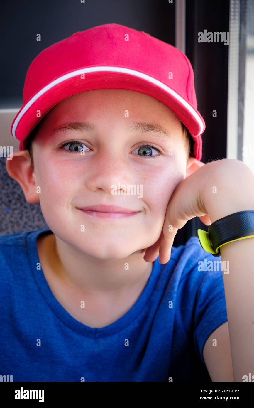 Boy wearing red baseball cap hi-res stock photography and images - Alamy