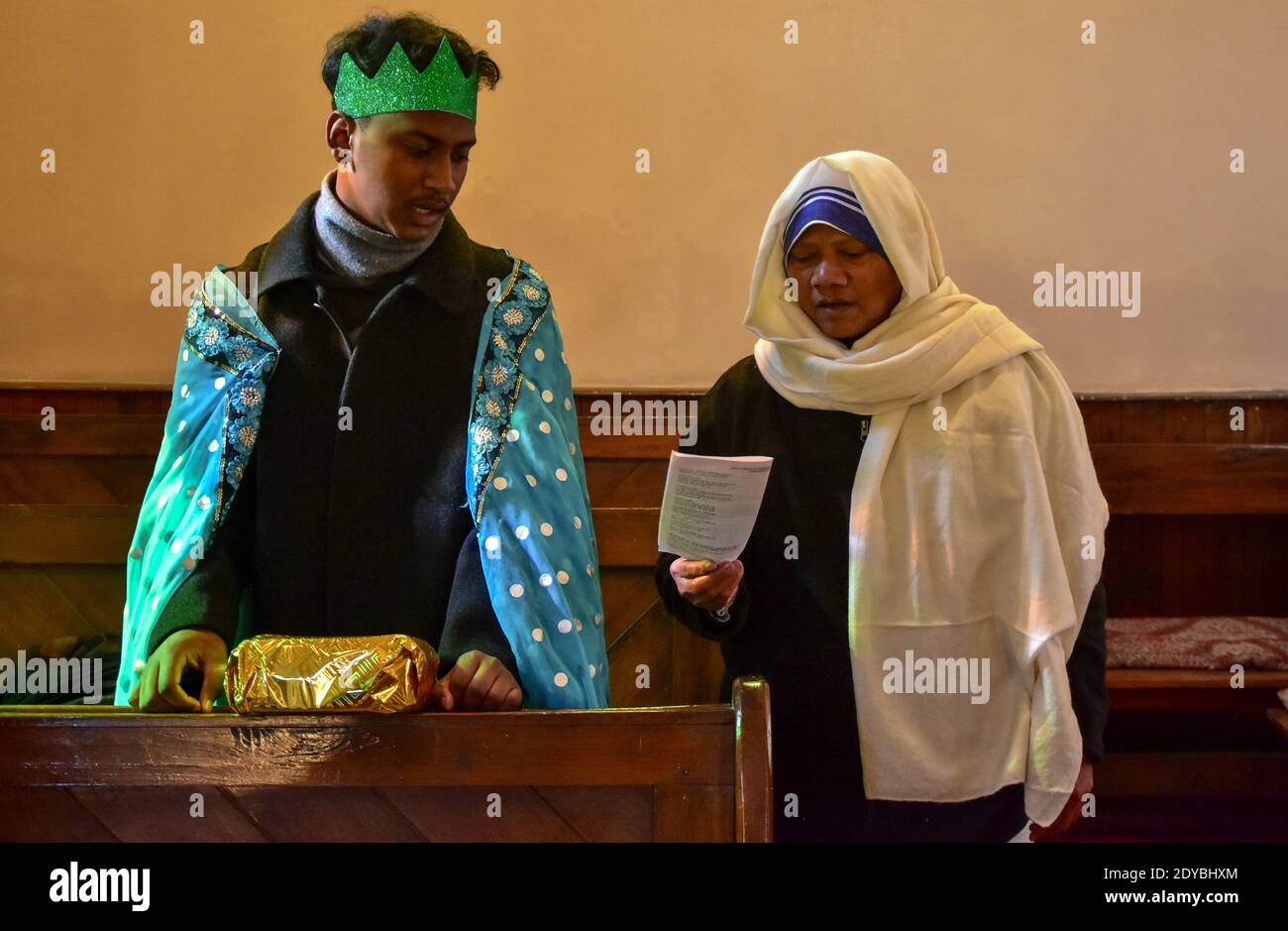 Christian devotees pray inside the Holy Family Catholic Church during ...