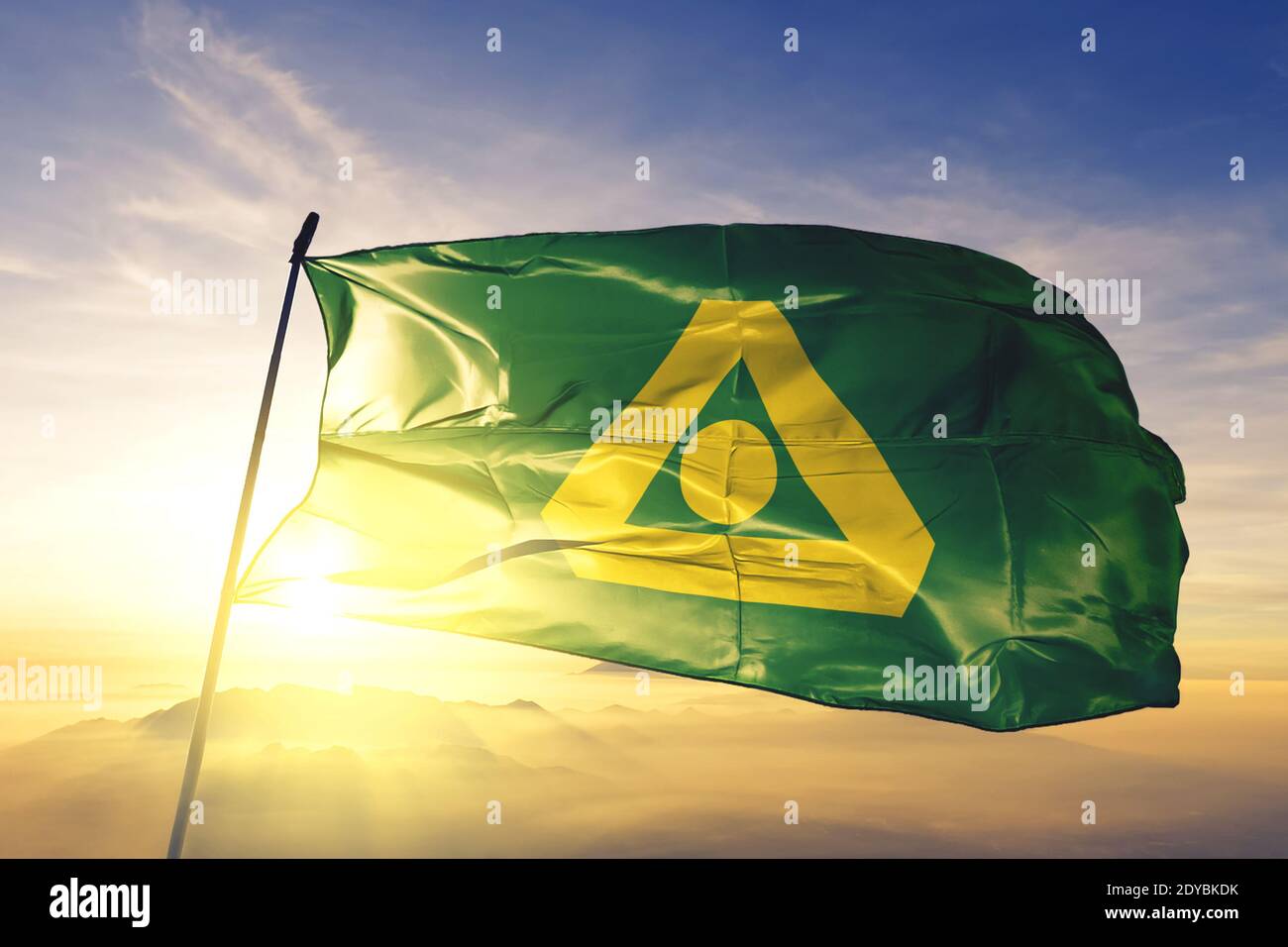 Delta of British Columbia of Canada flag waving on the top sunrise mist ...