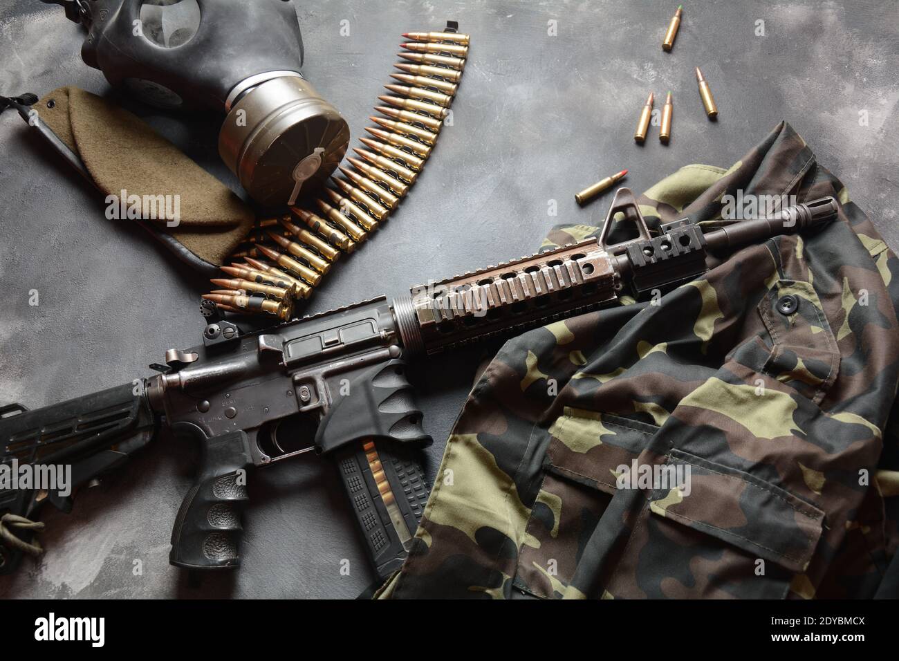 Assault rifle (M4A1) with ammunition on camouflage uniform,and military ...