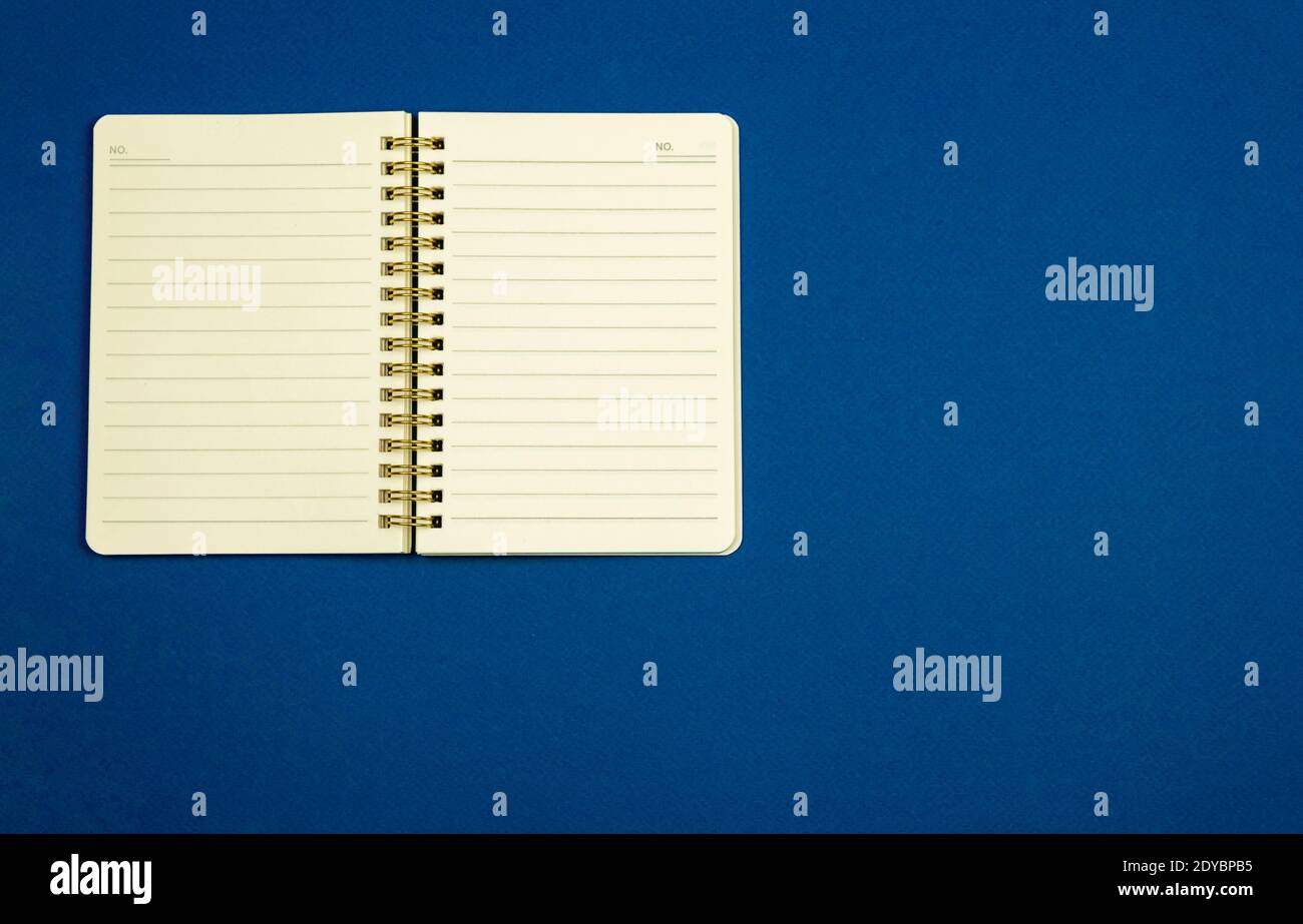 Notepad for notes on a simple blue background, flat design, top view ...