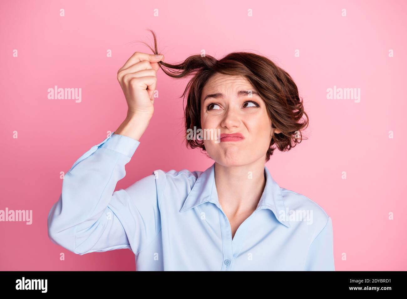 Closeup photo of attractive sad lady hold hairdo curl see split dry ...