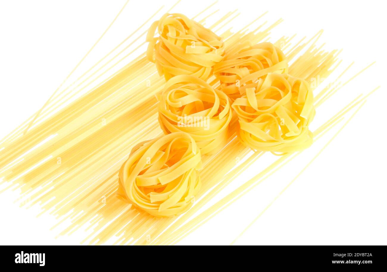 Raw dry tagliatelle noodle, italian pasta close up isolated on white ...