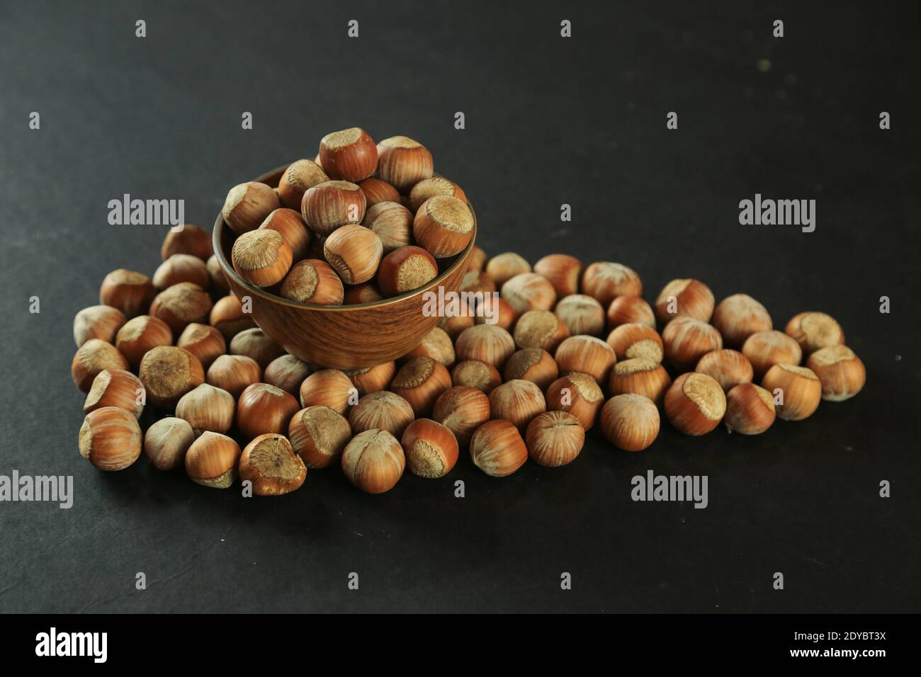Hazelnuts on wooden backdrop. Hazelnut background. High quality photo ...