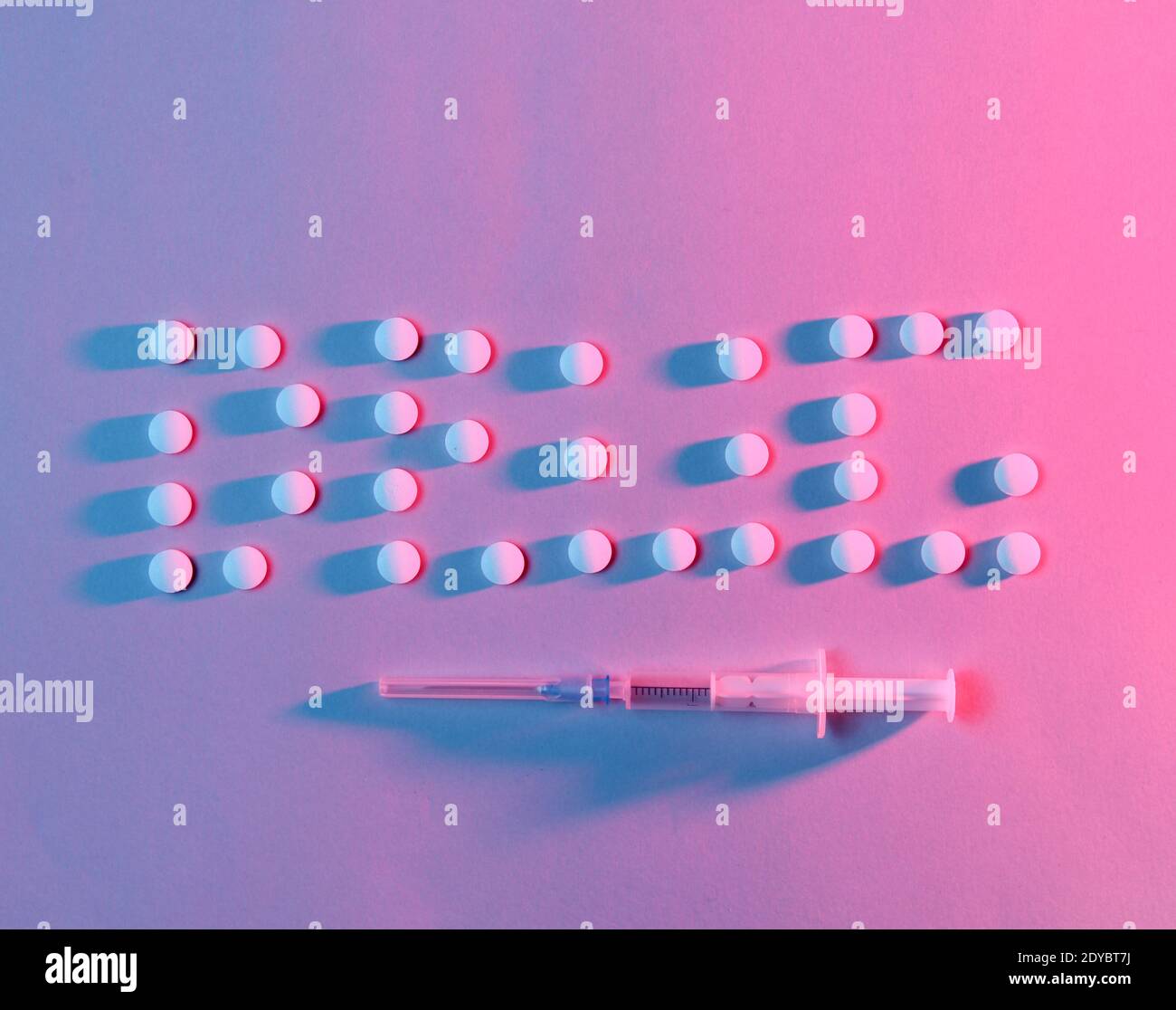 The concept of addiction. Lettering drug with pills. Syringe and pills ...