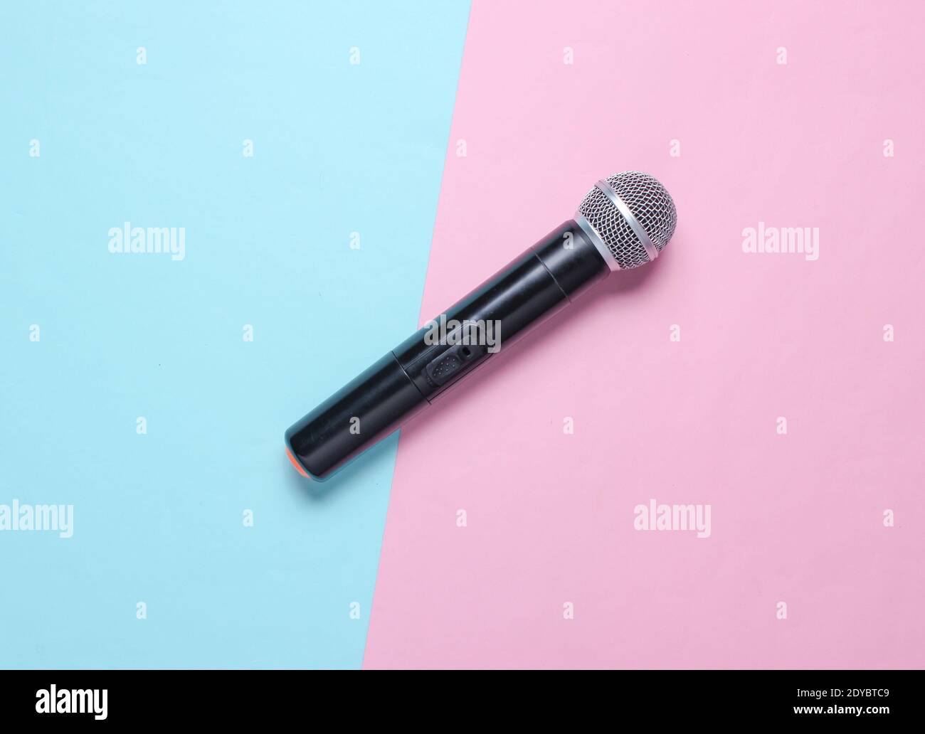 Wireless microphone on blue pink pastel background. Flat lay. Top view ...
