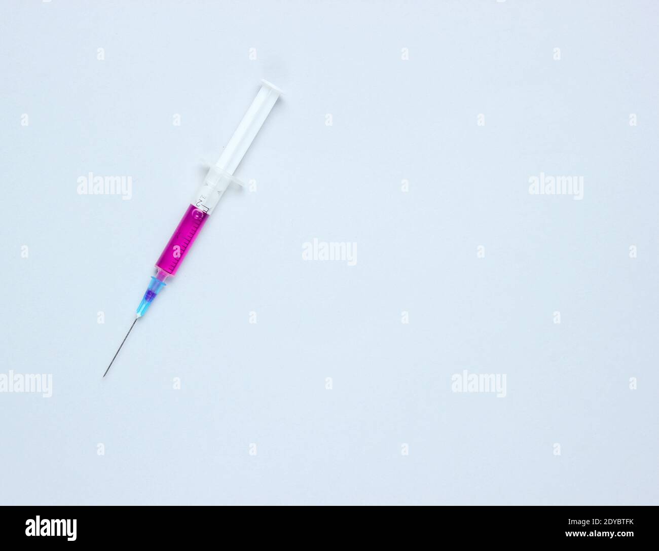 Medical concept, injection, vaccination. Syringe with purple liquid on ...