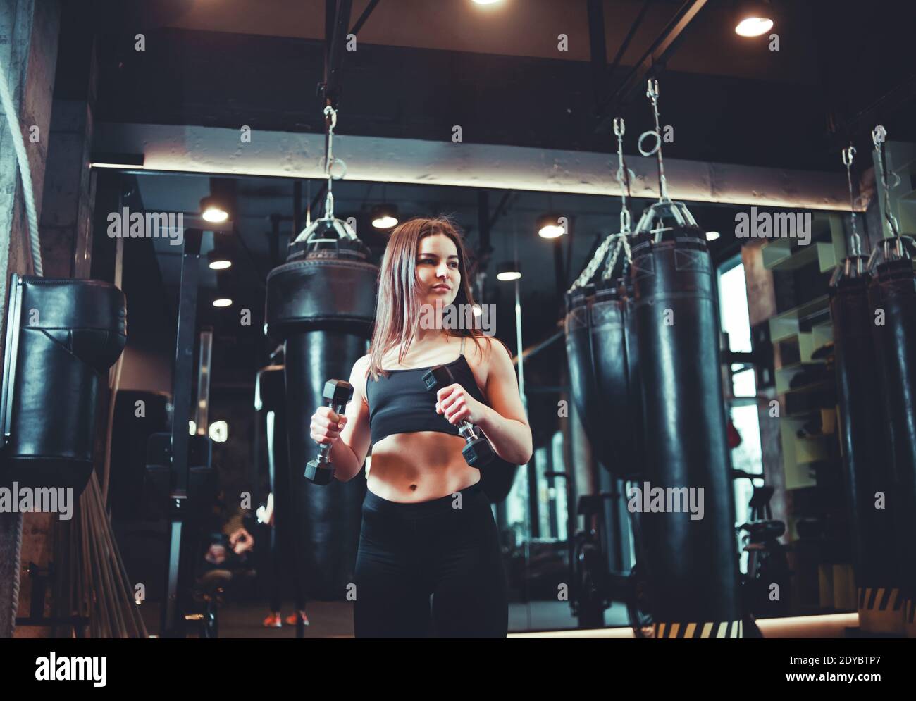 Female bodybuilder flexing biceps in hi-res stock photography and ...