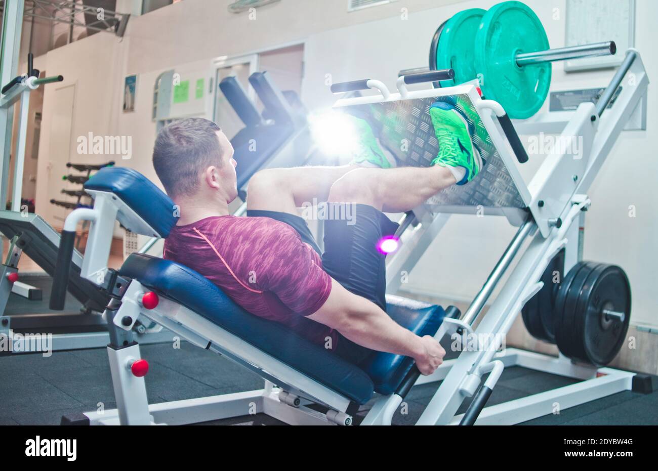 Gym machine leg lift hi-res stock photography and images - Alamy