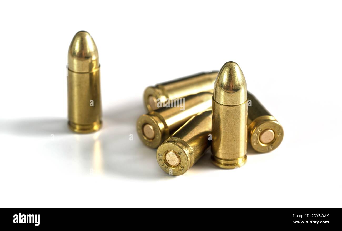 Yellow brass ammo bullets isolated on white background Stock Photo - Alamy