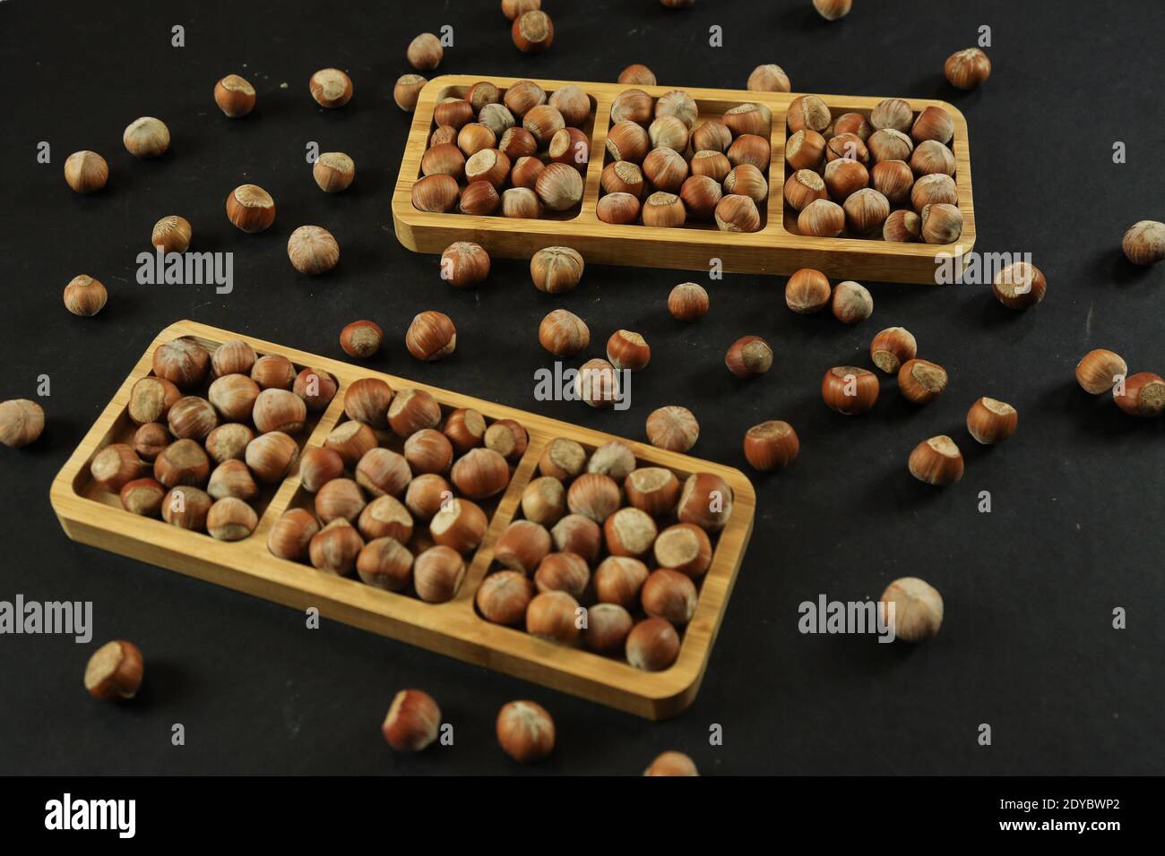 Hazelnuts on wooden backdrop. Hazelnut background. High quality photo ...