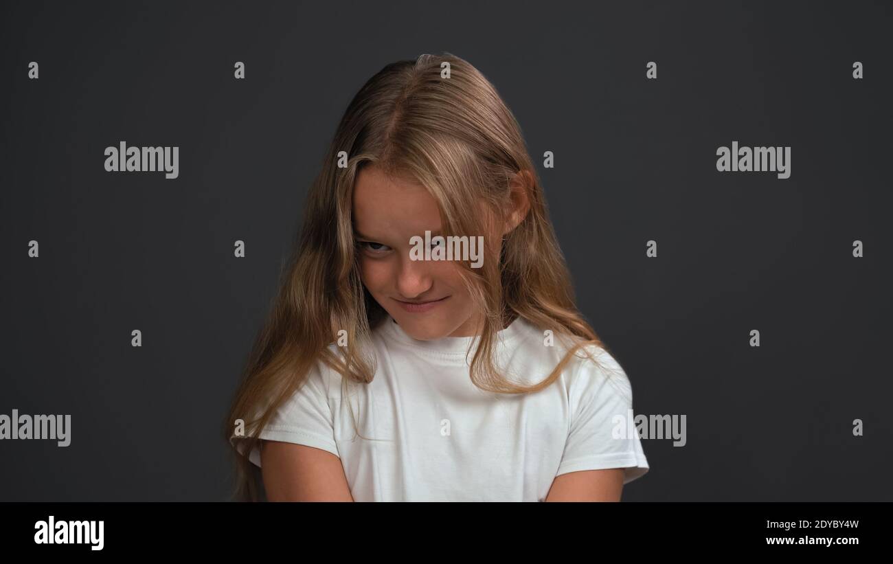 Played upset or defeated little girl listening parents with hands ...