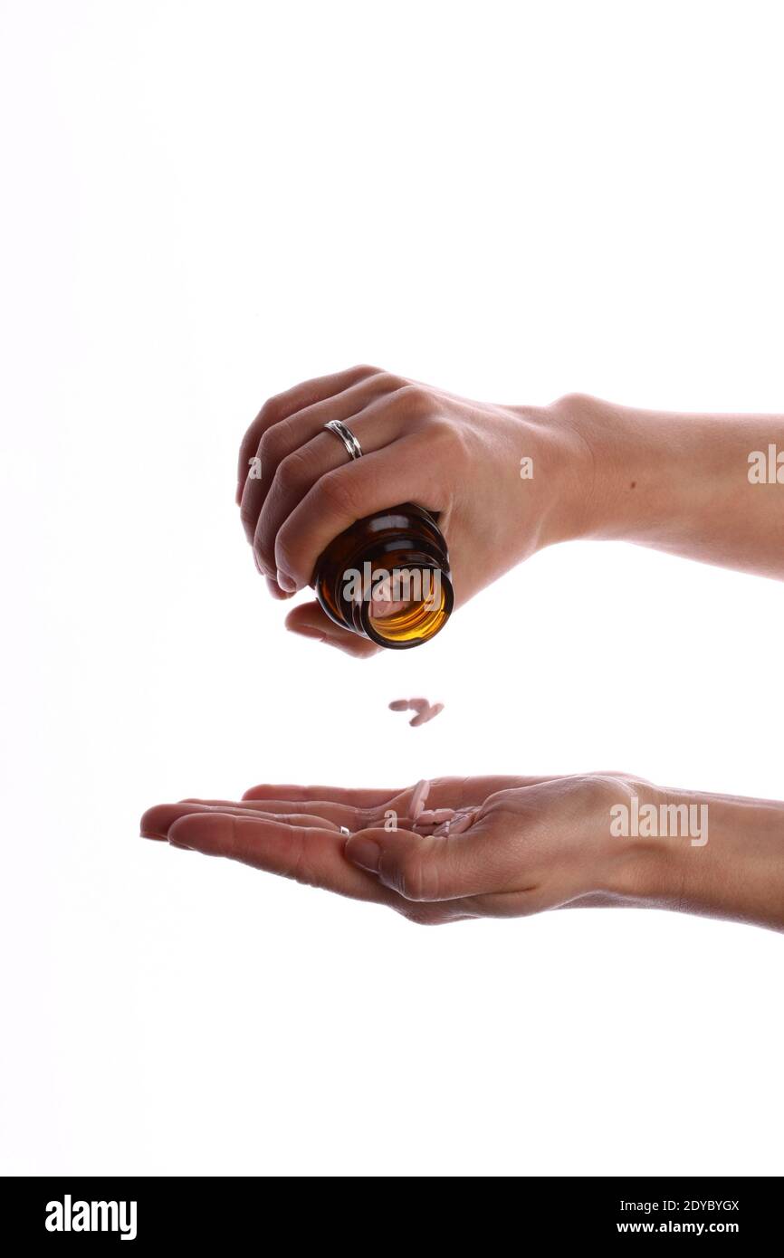 Pills falling out bottle hi-res stock photography and images - Alamy