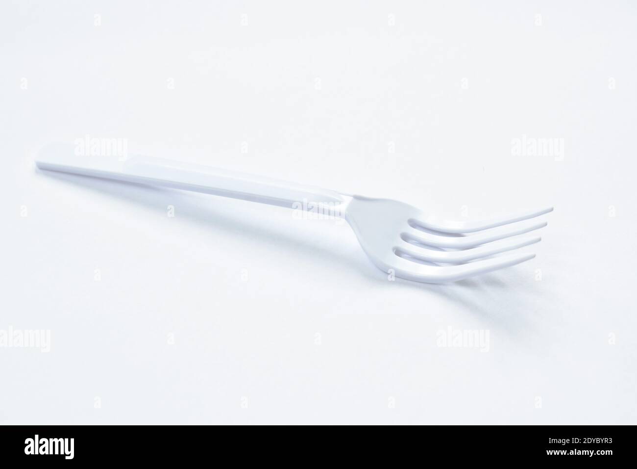 plastic fork for single used on white background Stock Photo - Alamy
