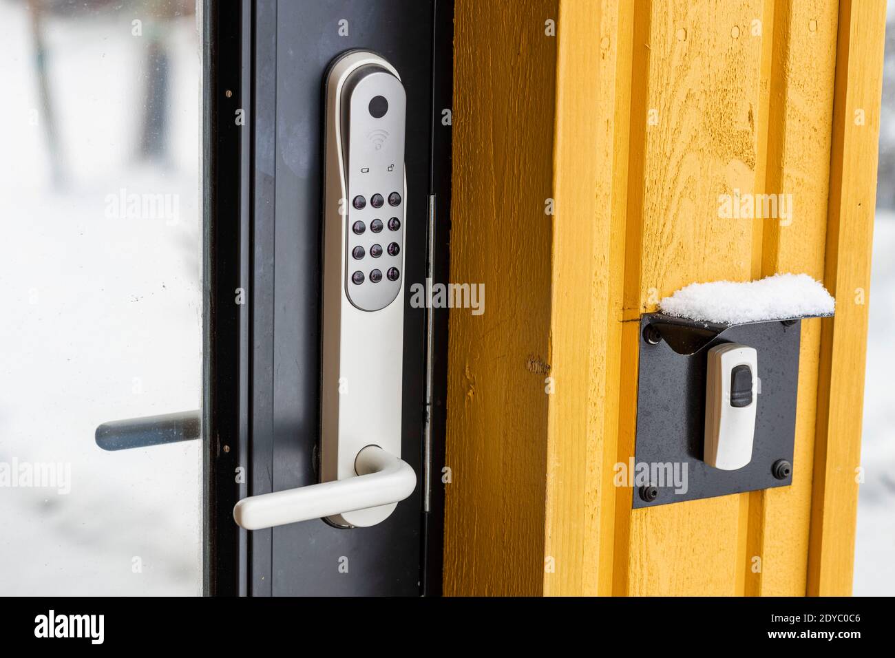 Close up view of an electric combination lock on a black door. Interior ...