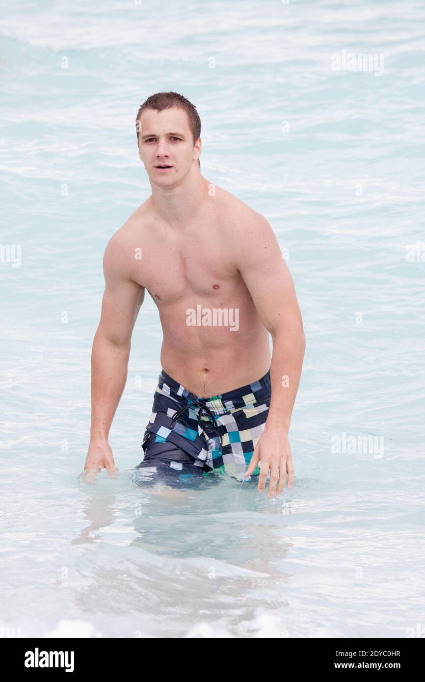 young muscular man in water Stock Photo - Alamy