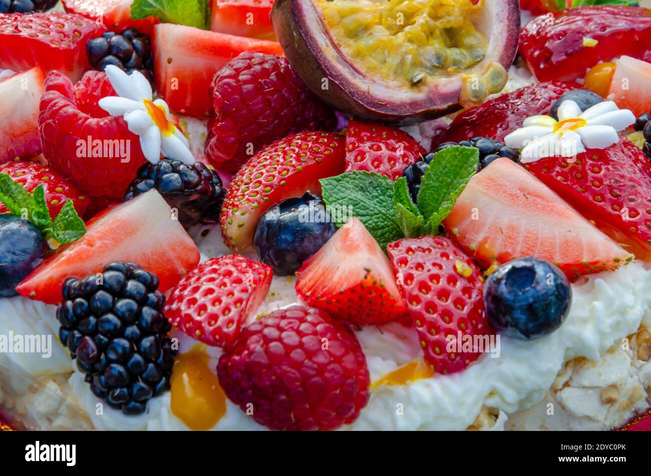 Anna Pavlova French dessert with blueberries, passion fruit ...