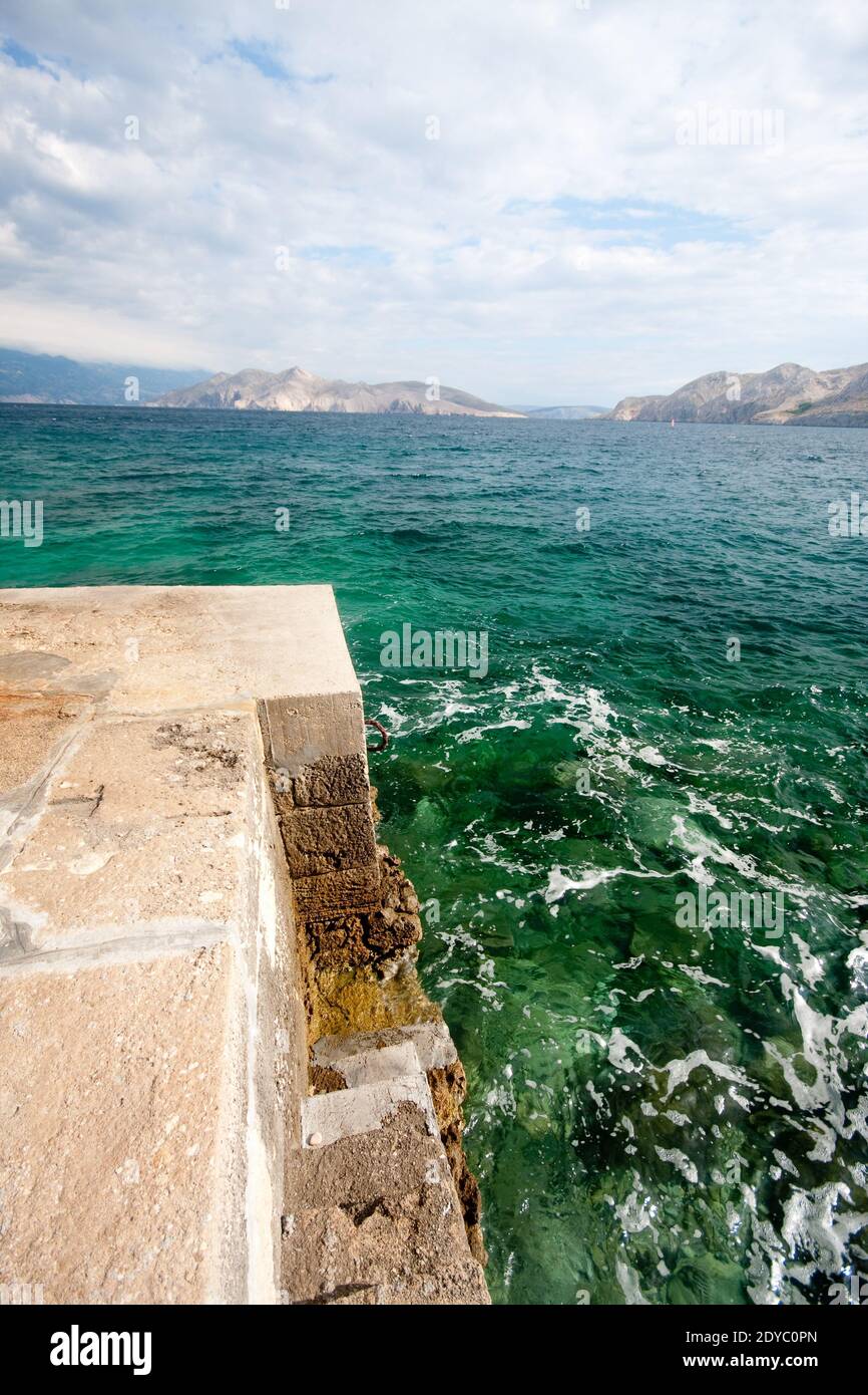 view of bay in Baska Stock Photo - Alamy