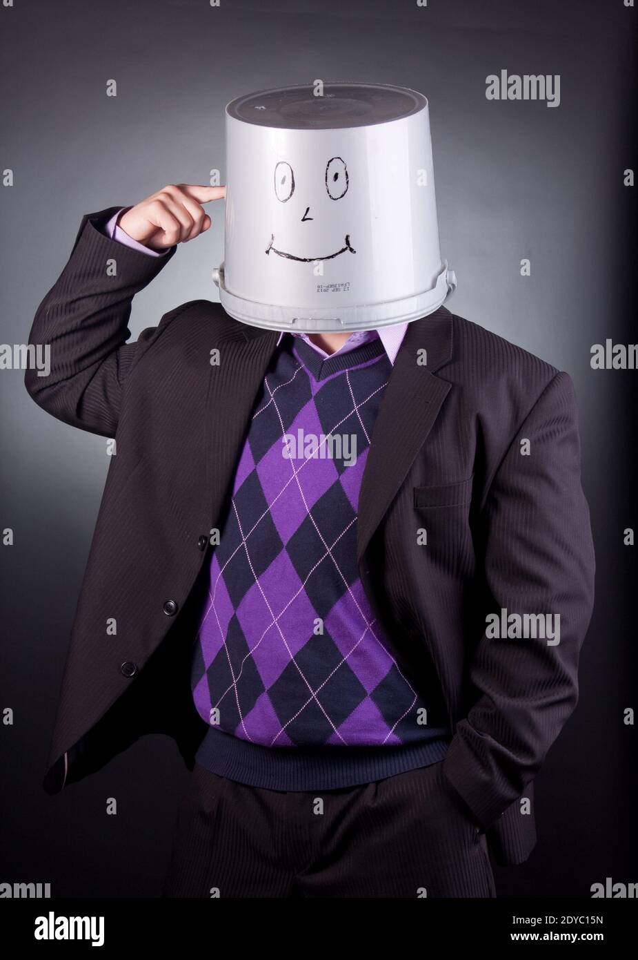 funny businessman with a bucket on his head Stock Photo - Alamy