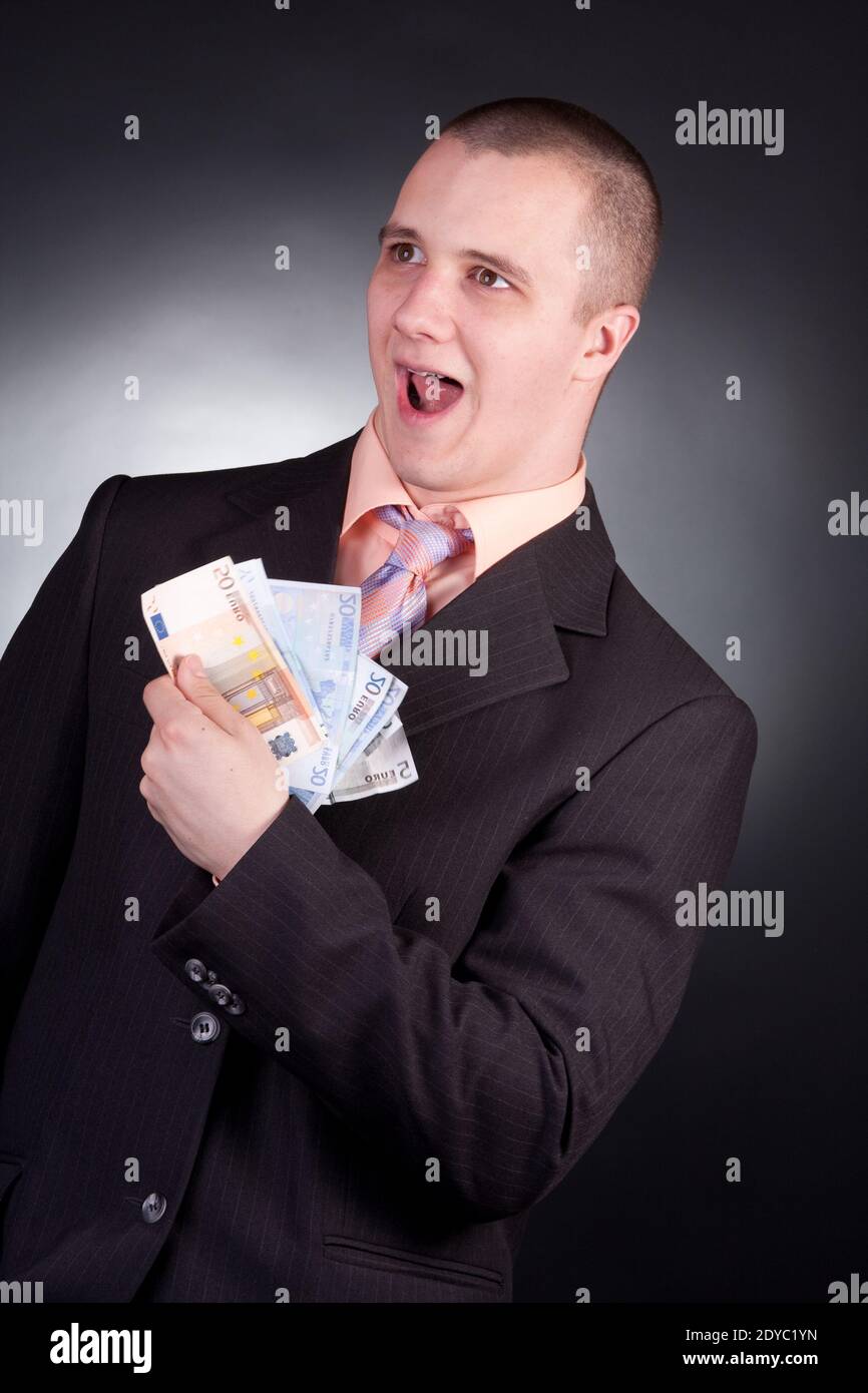 young handsome businessman with money Stock Photo - Alamy