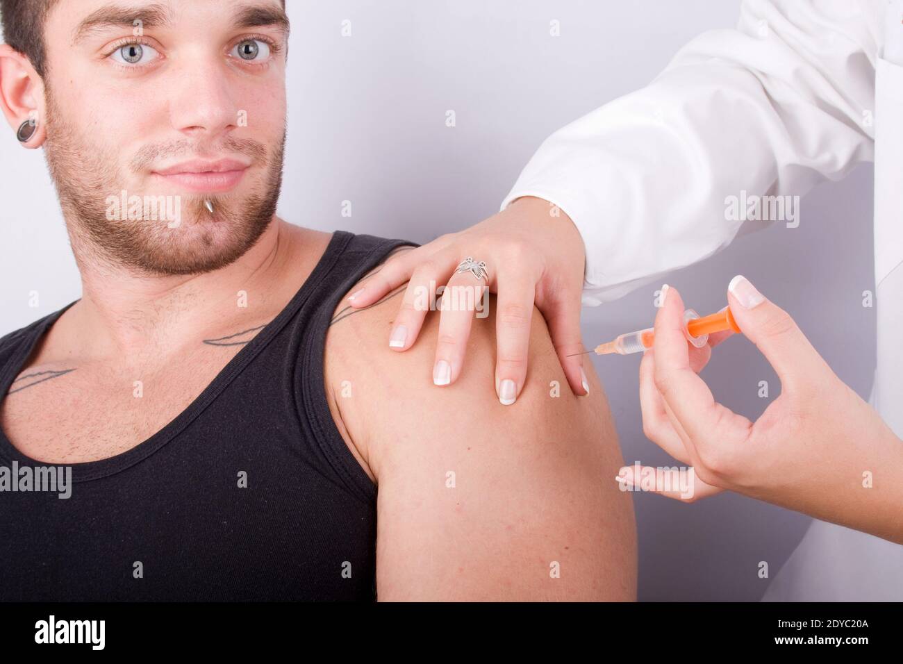 Young doctor women give an injection Stock Photo - Alamy