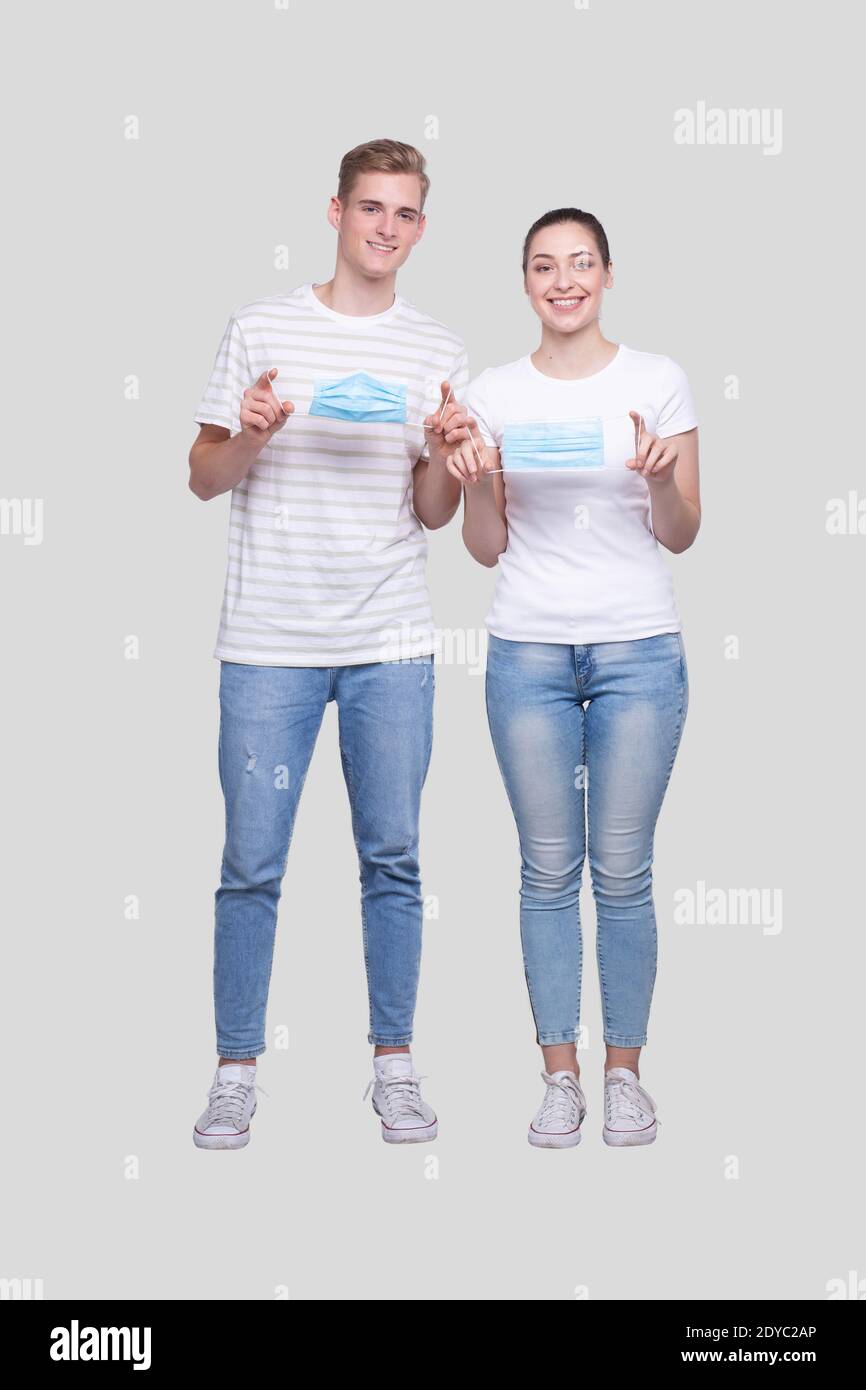 Couple Puts on Medical Mask Standing Isolated. Health protection ...