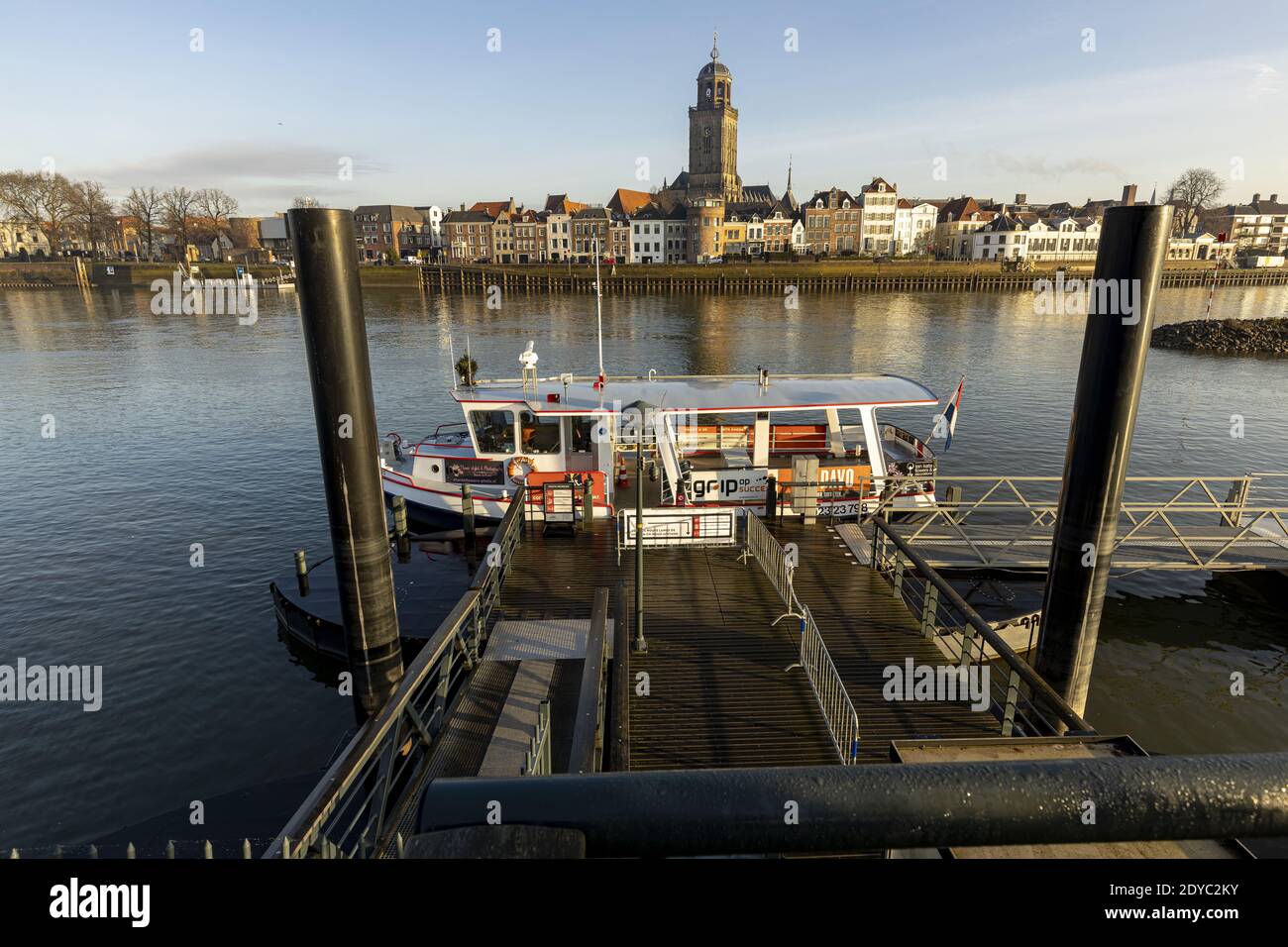 DEVENTER, NETHERLANDS - Dec 16, 2020: Quay jetty with ferryboat waiting ...