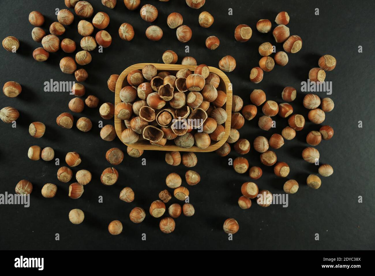 Hazelnuts on wooden backdrop. Hazelnut background. High quality photo ...