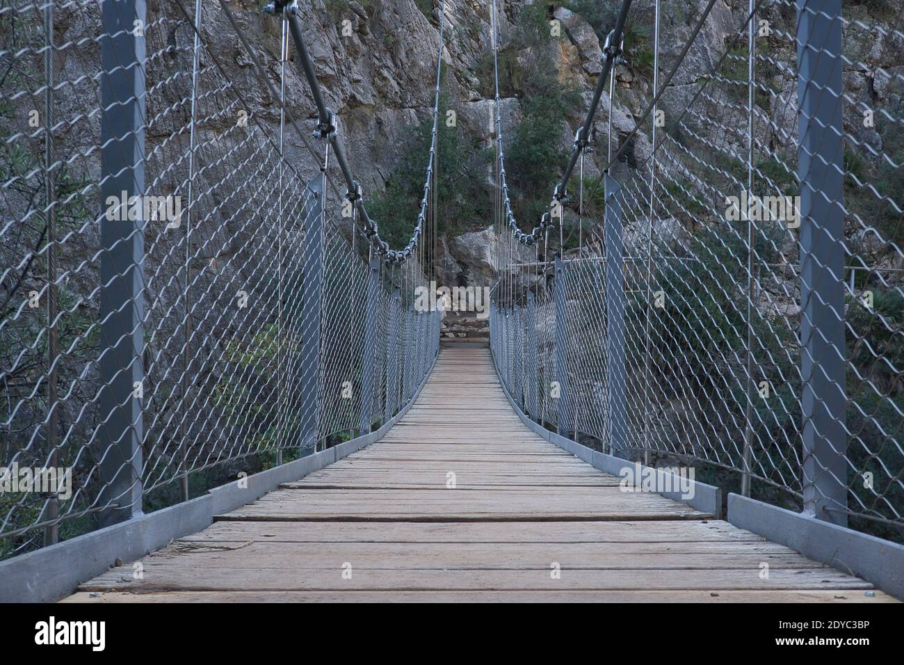 suspension bridge between two mountains in Spain Stock Photo - Alamy