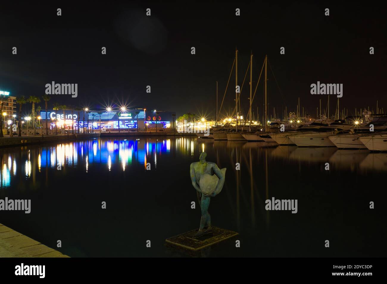 port in crescent moon night with reflections in the sea in spain Stock ...