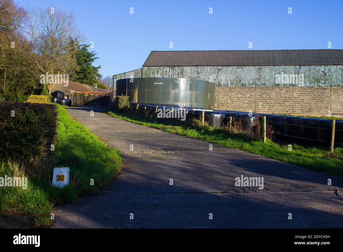 24 December 2020 A large green Alpha Laval slurry tank on a small farm ...