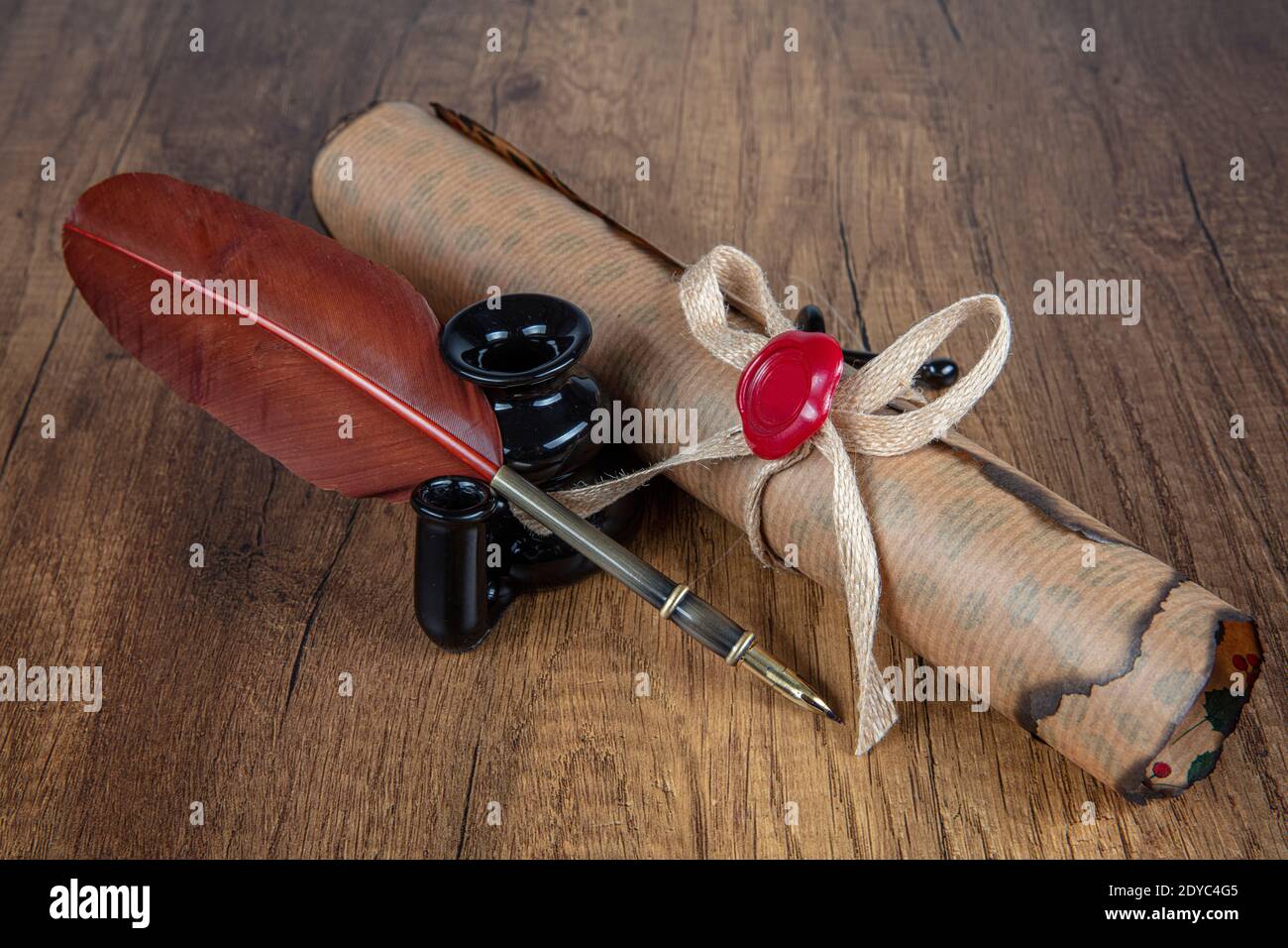 Photograph of a fountain pen with an old inkwell and several ...
