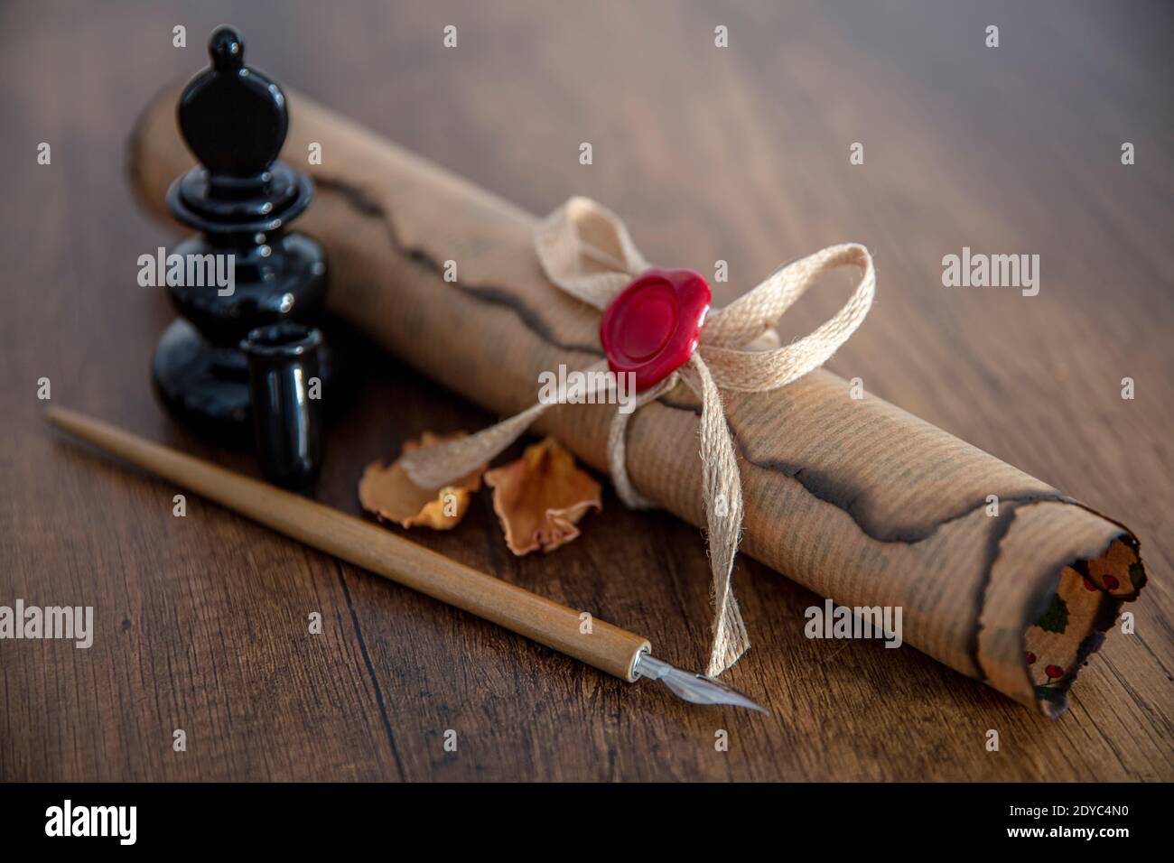 Photograph of a fountain pen with an old inkwell and several ...