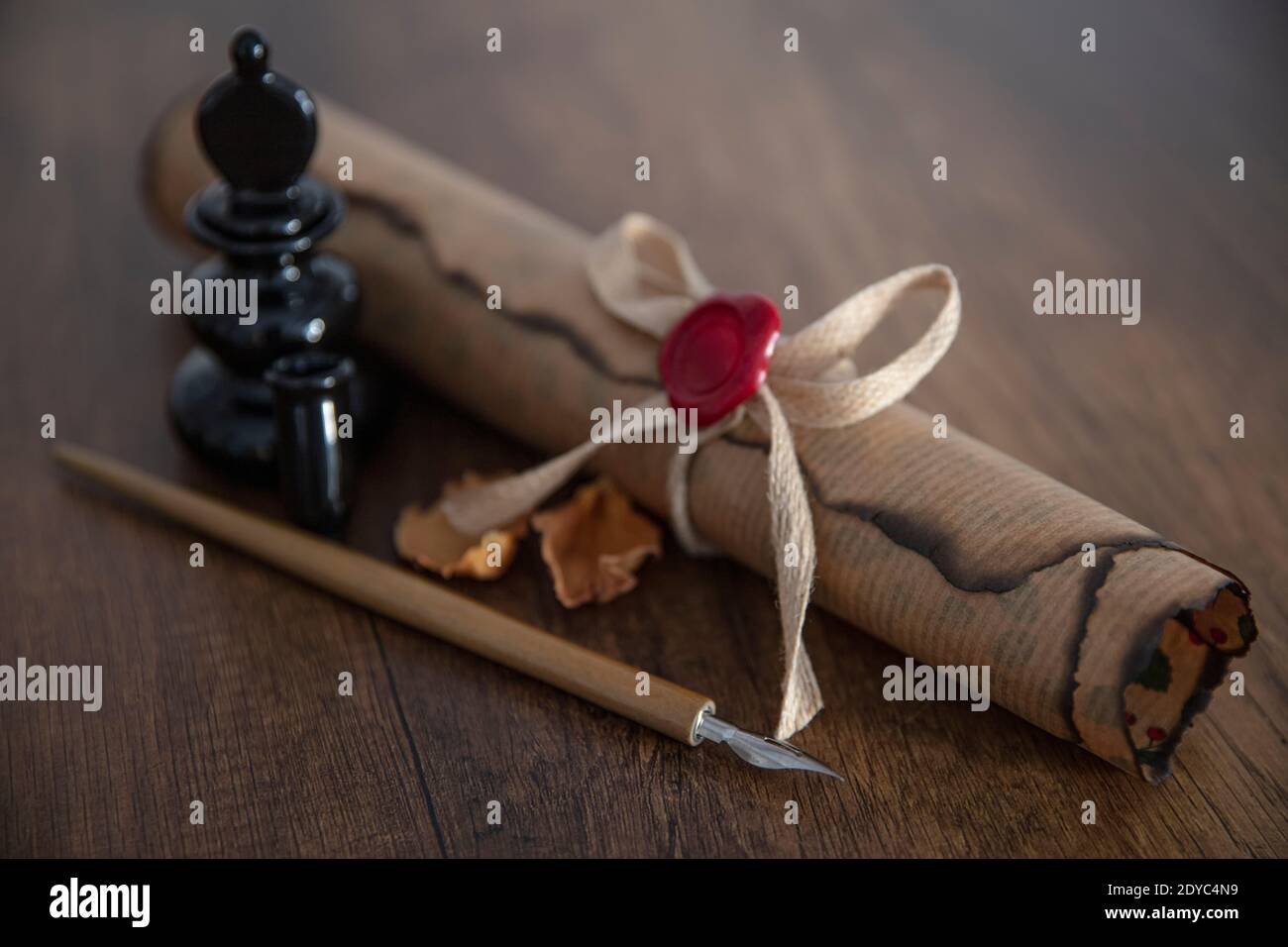 Photograph of a fountain pen with an old inkwell and several ...
