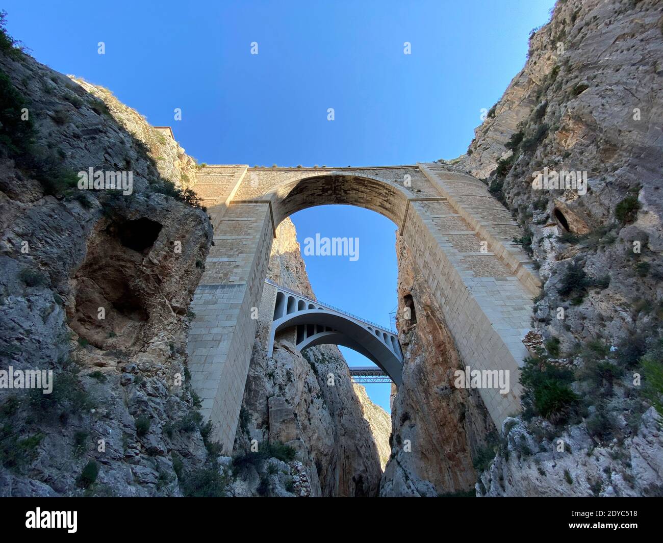 ancient roman bridge joining a canyon in spain Stock Photo - Alamy