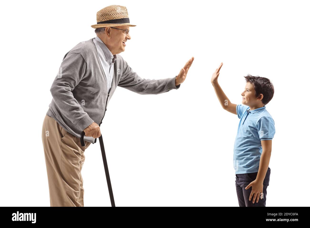 Elderly man and a boy gesturing high-five isolated on white background ...