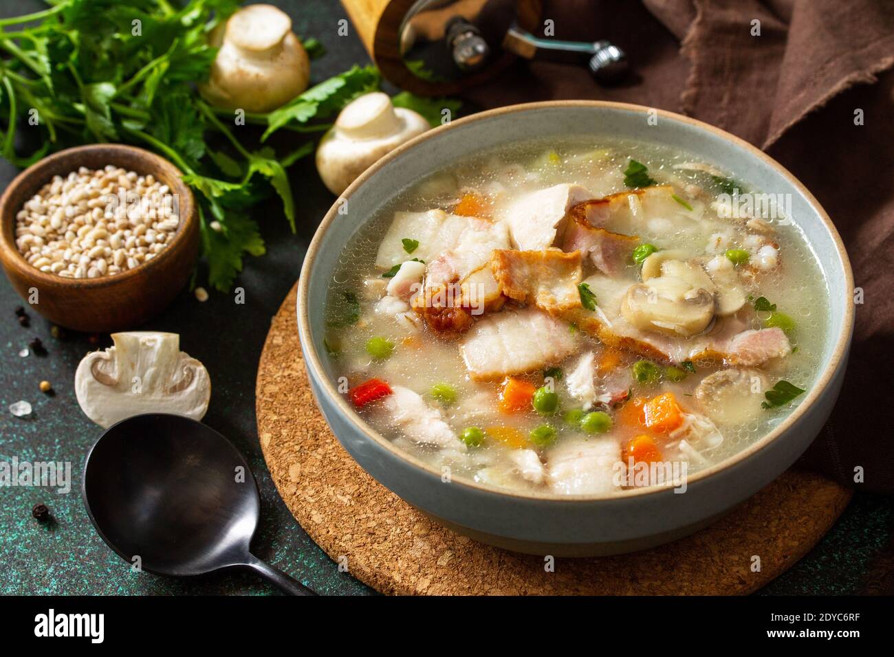 Healthy eating. Homemade hearty soup with cereals, bacon and mushrooms ...