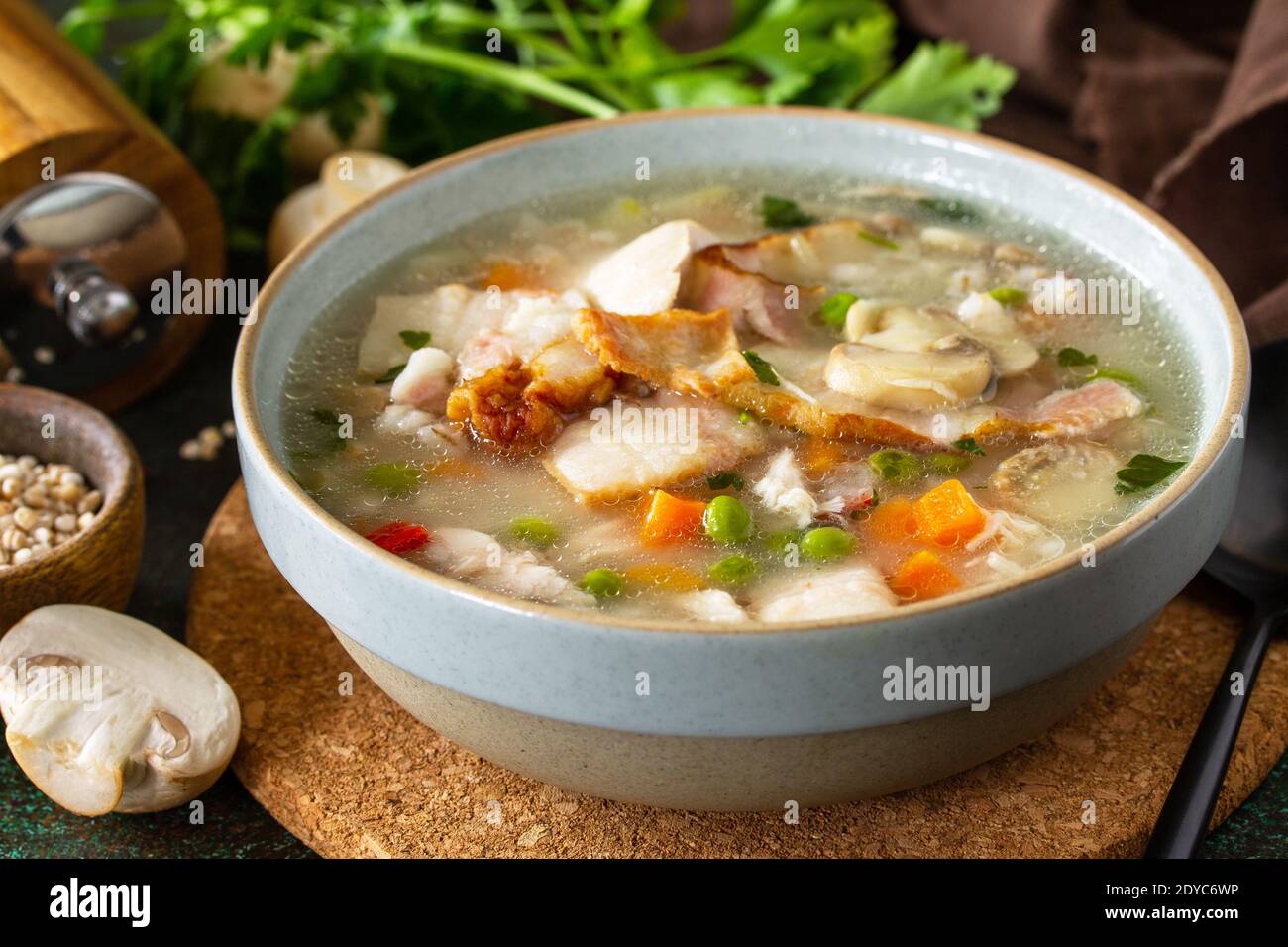 Healthy eating. Homemade hearty soup with cereals, bacon and mushrooms ...