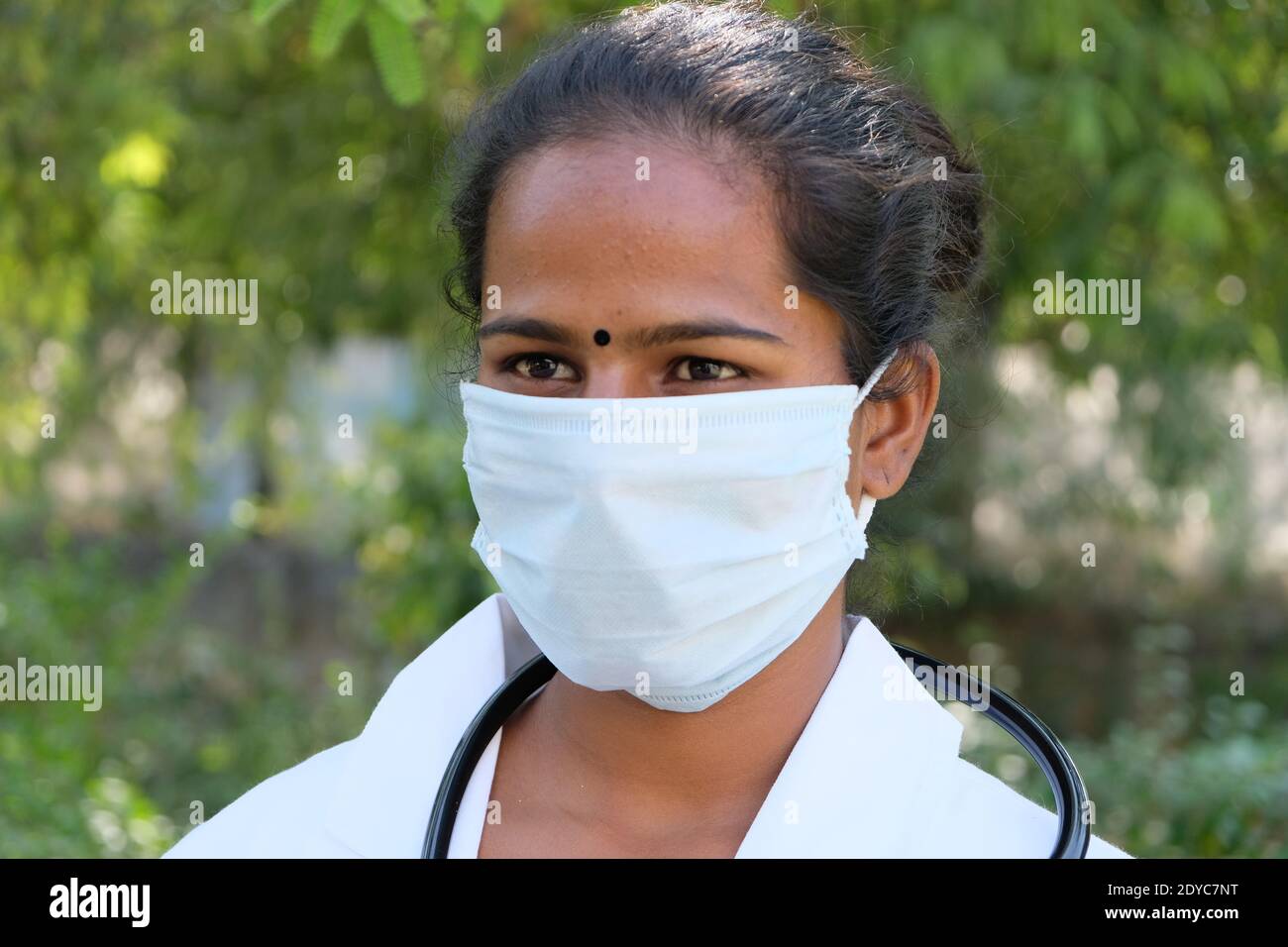 An Indian doctor with a stethoscope wearing a mask Stock Photo - Alamy