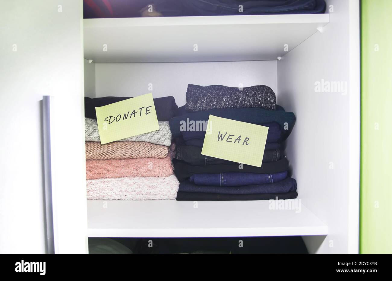 Home wardrobe with different clothes sorted for donation Stock Photo ...