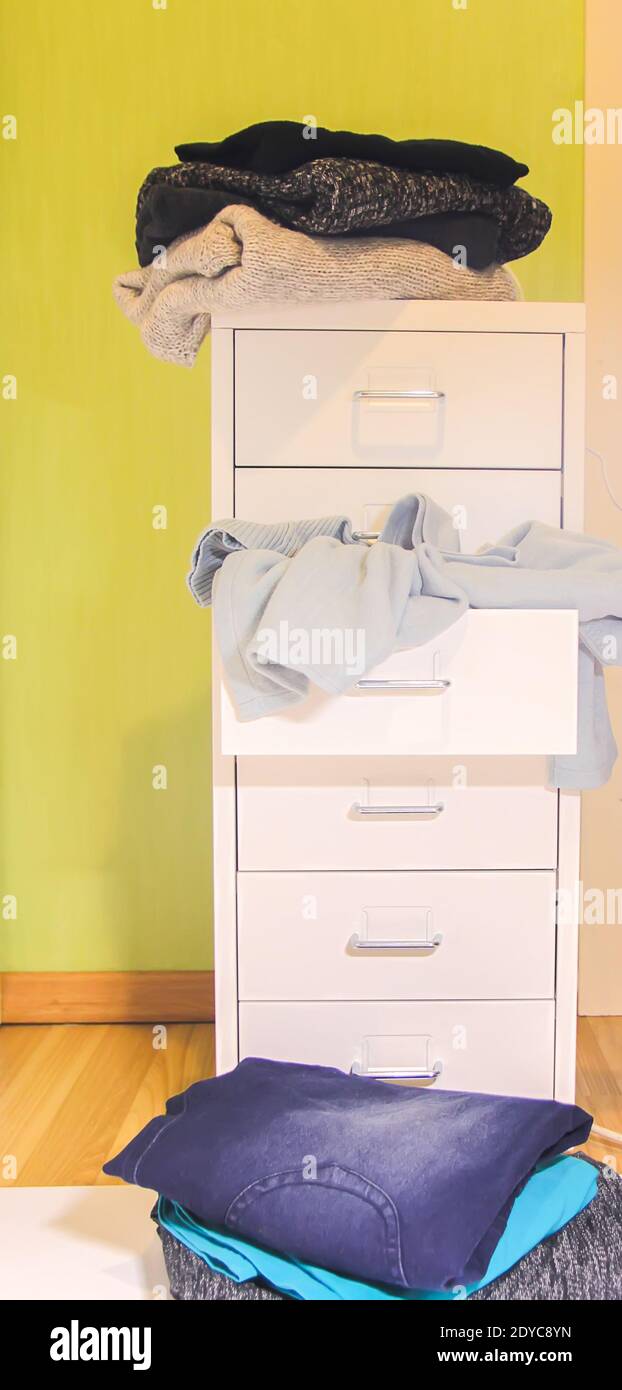 Home wardrobe with different clothes in disorder Stock Photo - Alamy