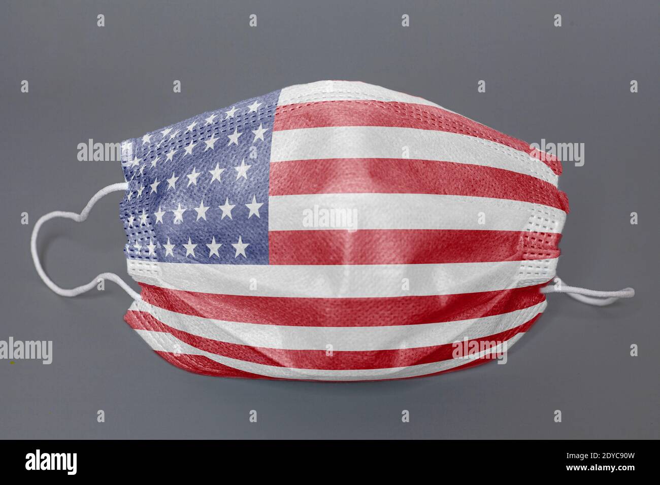 Medical protective mask with USA flag on grey background Stock Photo ...