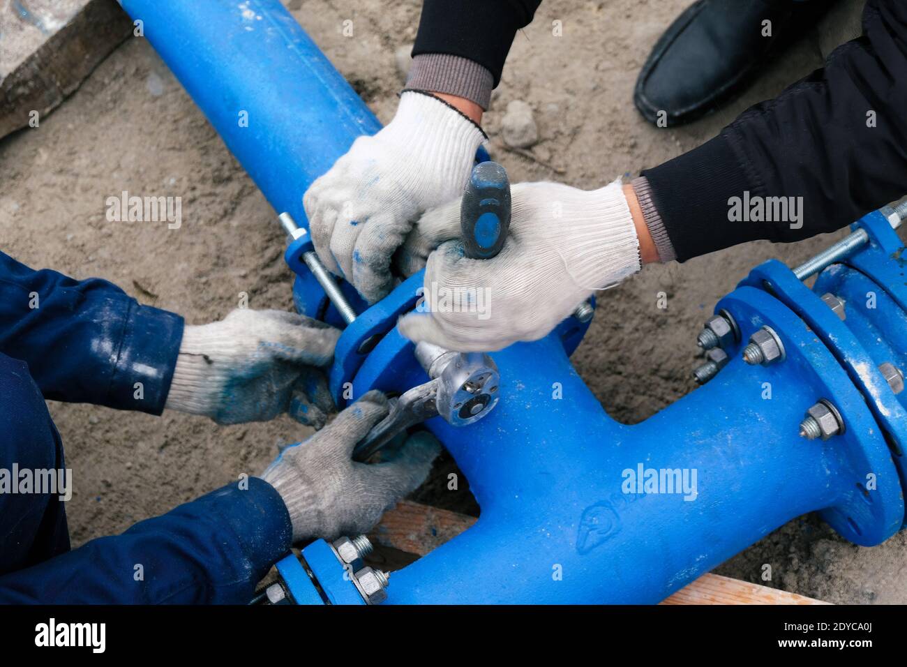 Workers installing water supply pipeline system, close up Stock Photo ...